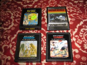 atari 2600 4-game cartridge lot - pac-man defender demon attack combat