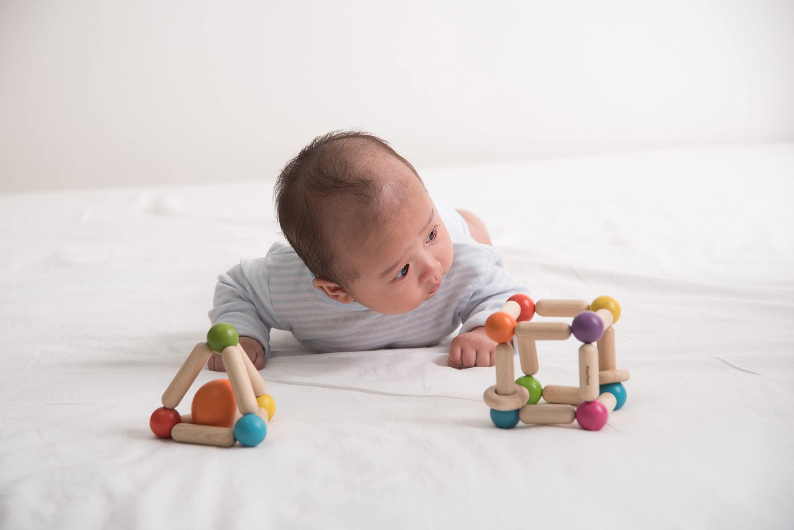 PlanToys Wooden Clutching Triangle Baby Toy with Gentle Sound in Two-Toned Ball (5244) | Sustainably Made from Rubberwood and Non-Toxic Paints and Dyes