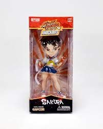 Cryptozoic Street Fighter Knockouts Series 1: Sakura Vinyl Figure, 7.5 inches