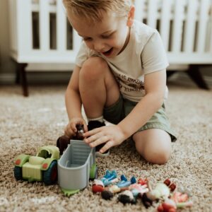 HABA Little Friends Tractor and Trailer - 2 Piece Farm Play Set with Movable Hatch