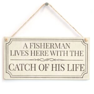 a fisherman lives here with the catch of his life - funny home accessory gift sign for retired fisherman