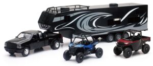 new ray toys die cast pick up truck with toy hauler and 2 polaris vehicles (blue rzr and red ranger)