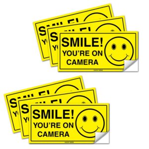 (set of 6) smile you're on camera sign - 2" x 4" - 4 mil vinyl - laminated for ultimate protection & durability - self adhesive decal - uv protected & weatherproof - heavy duty