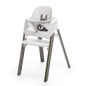 stokke steps high chair - hazy grey legs & white seat - 5-in-1 seat system - includes baby set - suits babies 6-36 months - chair holds up to 187 lbs. - tool free & adjustable