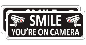 smile you're on camera sign (2 pack), video surveillance sign metal, 10" x 3.5" home security signs for house business, camera warning sign outdoor, aluminum cctv sign for yard