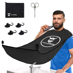 striking viking beard bib & hair catcher apron for shaving & trimming - 4-piece grooming kit with scissors, suction cups, storage bag & beard cape - shaving hair catcher