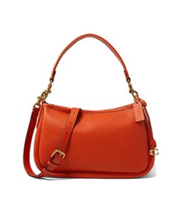 coach soft pebble leather cary crossbody bag for women offers zipper closure with detachable strap sun orange one size one size